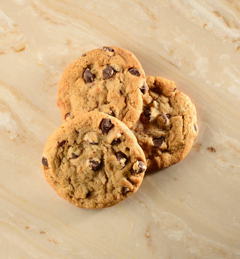Three Chocolate Chip Cookies on a Table Stock Photo - Image of chip ...
