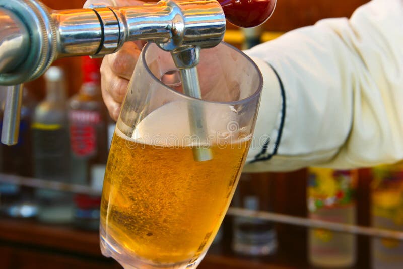 Beer on Tap stock photo. Image of hand, glass, bubble - 33800316