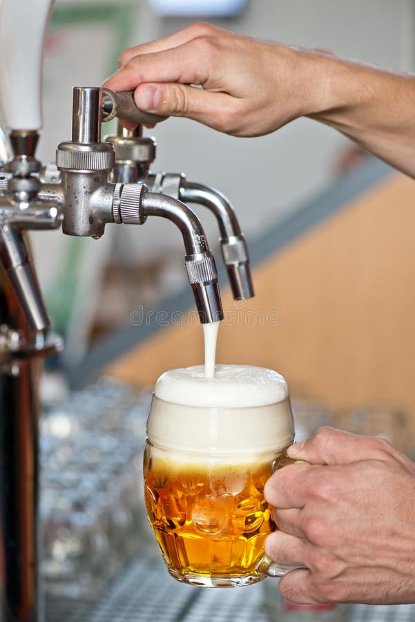 Beer on tap stock image. Image of glass, beer, hand, draft - 31290083