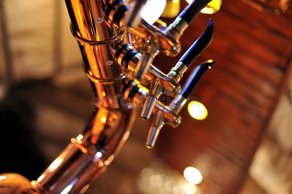Golden beer taps stock image. Image of party, blur, night - 19749515