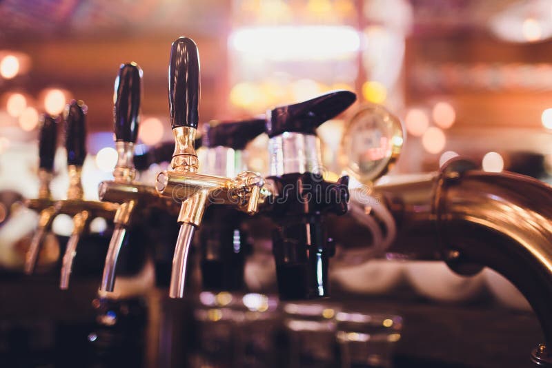 Beer Tap Pours Draught Lager Beer Serving in a Restaurant or Pub. Stock ...