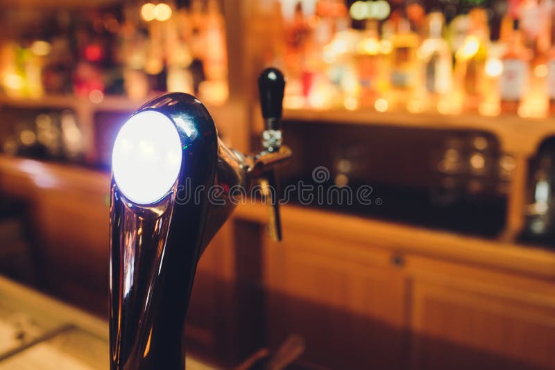 Beer Tap Pours Draught Lager Beer Serving in a Restaurant or Pub. Stock ...
