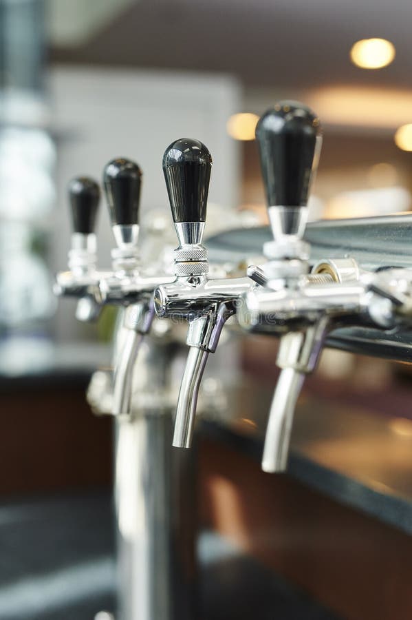 Beer tap row stock photo. Image of drinks, alignement - 53386014