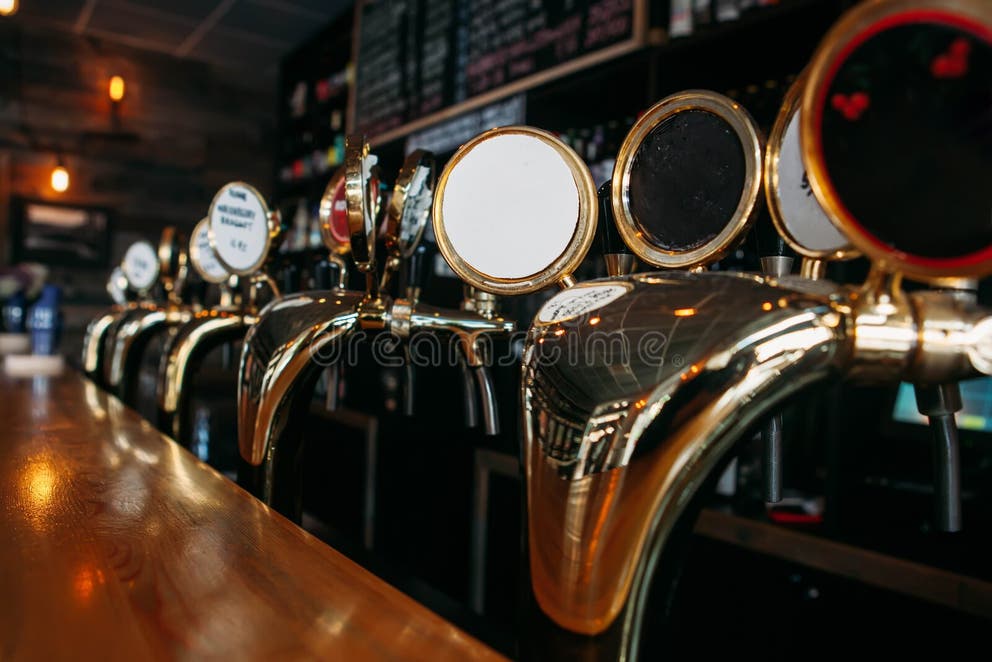 Beer tap in a row pub stock image. Image of maturing - 88712657