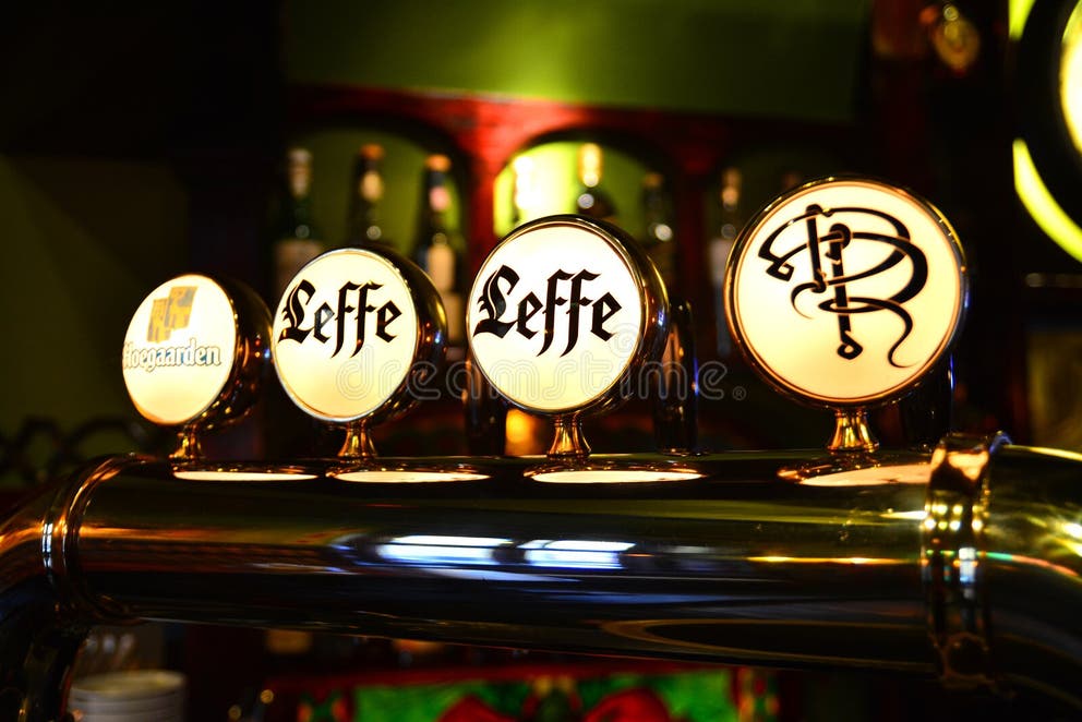 Beer taps editorial photo. Image of leffe, pour, brass - 37842526