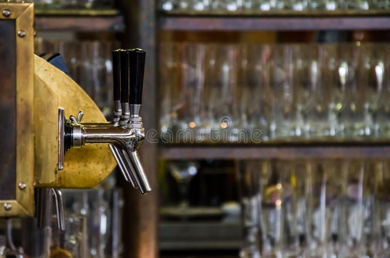 Beer Taps and Shelves with Beer Glasses Stock Image - Image of glare ...