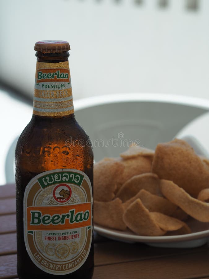 Beerlao Beer with Plate of Chips on the Table in Xishuangbanna, China ...