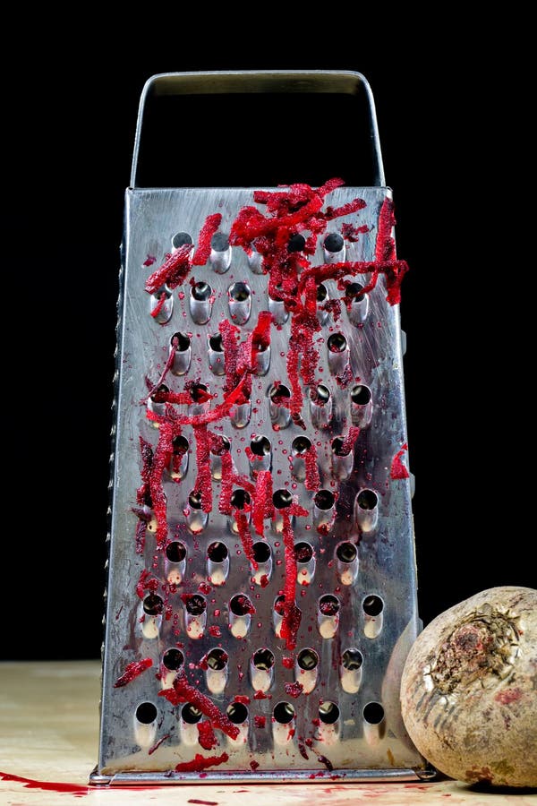 Beet Grated on a Kitchen Grater. Kitchen Countertop and Preparation of ...
