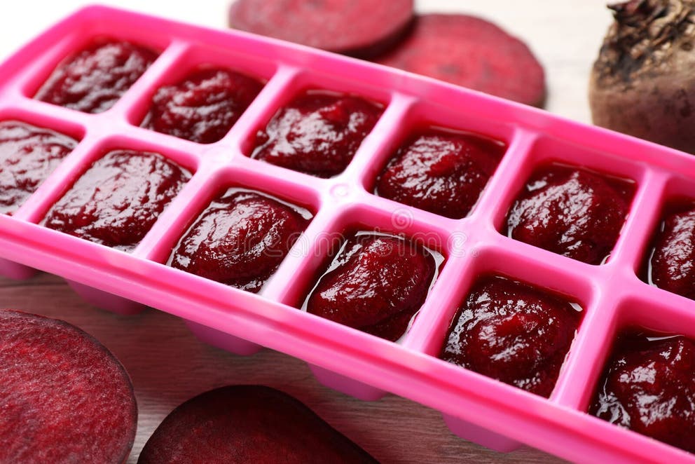Beet Puree in Ice Cube Tray on Table, Closeup. Ready for Freezing Stock ...