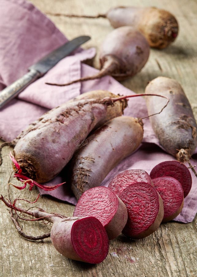 Beet roots on wooden table stock image. Image of agriculture - 65149585