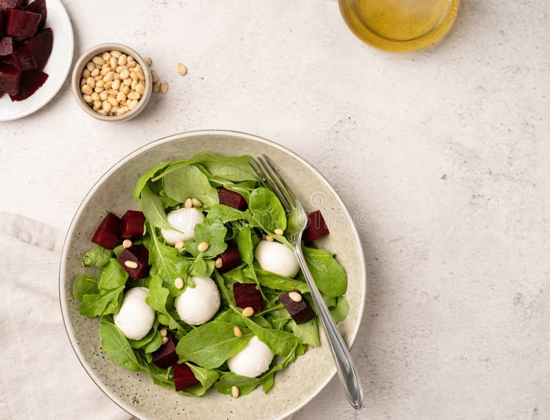 Beetroot, Mozzarella and Arugula Salad with Pine Nuts Top View Stock ...