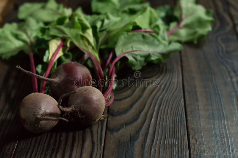 Beetroot on a wooden table stock photo. Image of home - 118731786