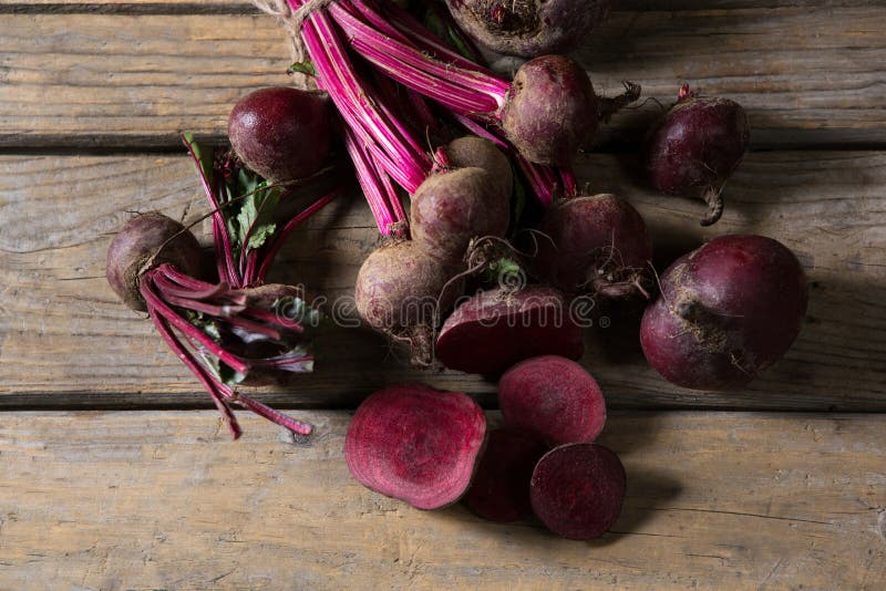 Beetroot on wooden table stock illustration. Illustration of slice ...