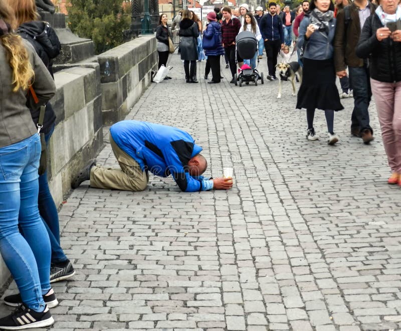 Beggar with Dog Begging for Alms on the Street in Prague Editorial ...