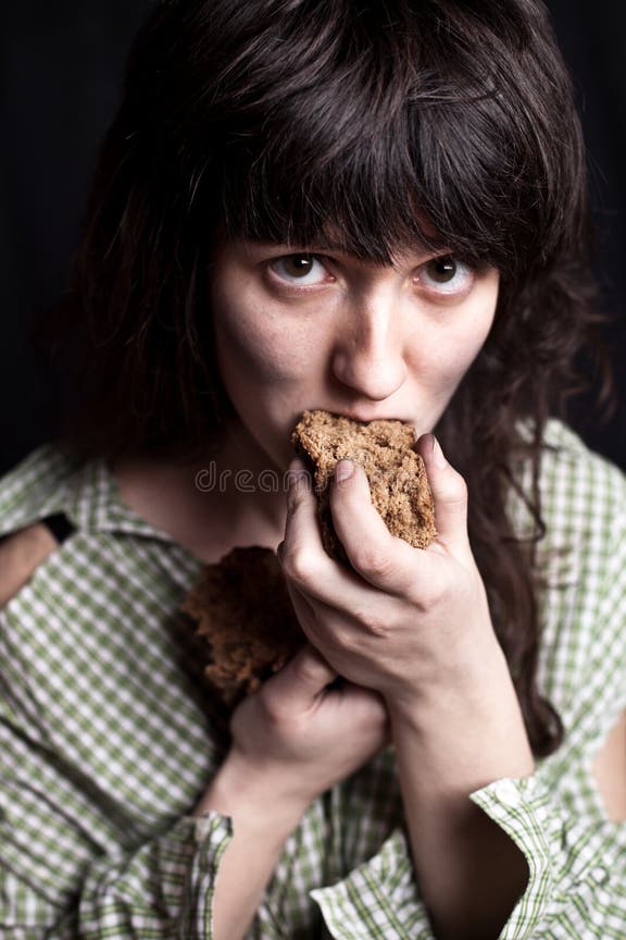 Beggar woman eating bread stock photo. Image of bread - 23116206