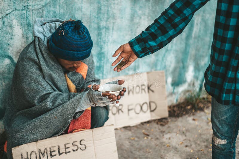 The Beggars Sit on the Side of the Road and Have Money Stock Image ...