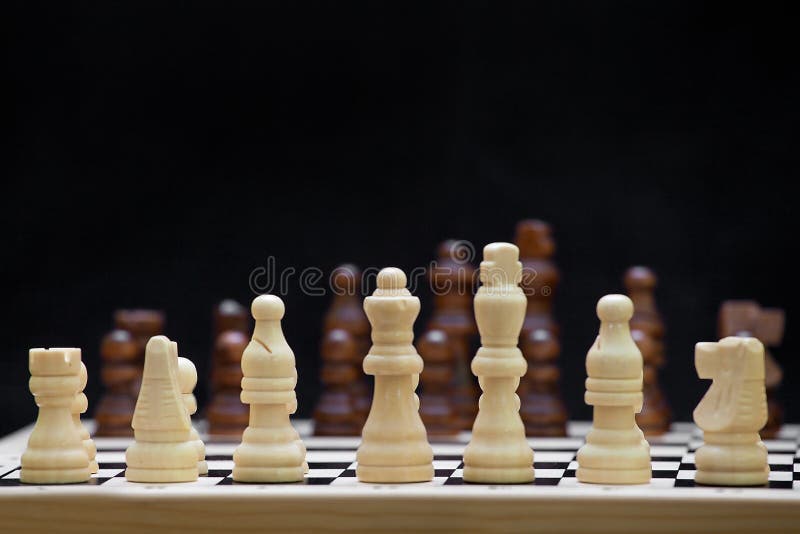 The Beginning of a Chess Game on the Black Backgroung Stock Photo ...