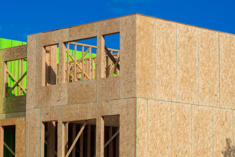 The Beginning of the Construction of a Plywood House Against the Blue ...