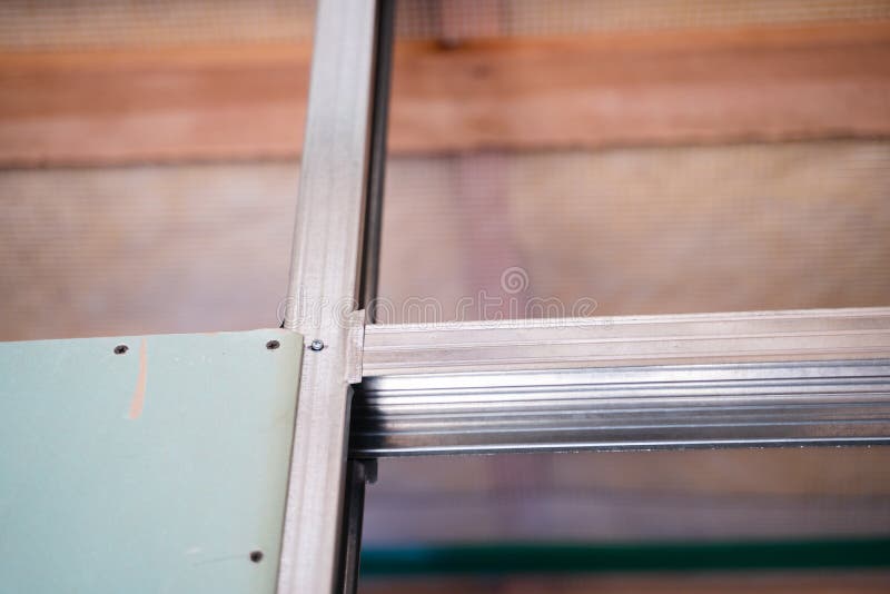 The Beginning of the Process of Sheathing the Frame with Drywall. One ...