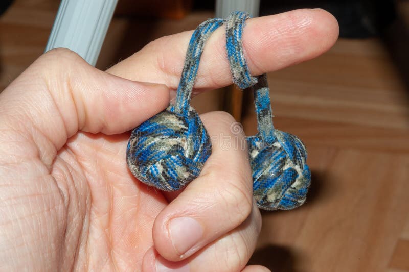 Begleri Hanging from Finger Stock Photo - Image of pattern, colorful ...