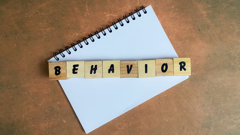 Concept of Behavior Writing on Wooden Cube Isolated on Work Desk. Stock ...