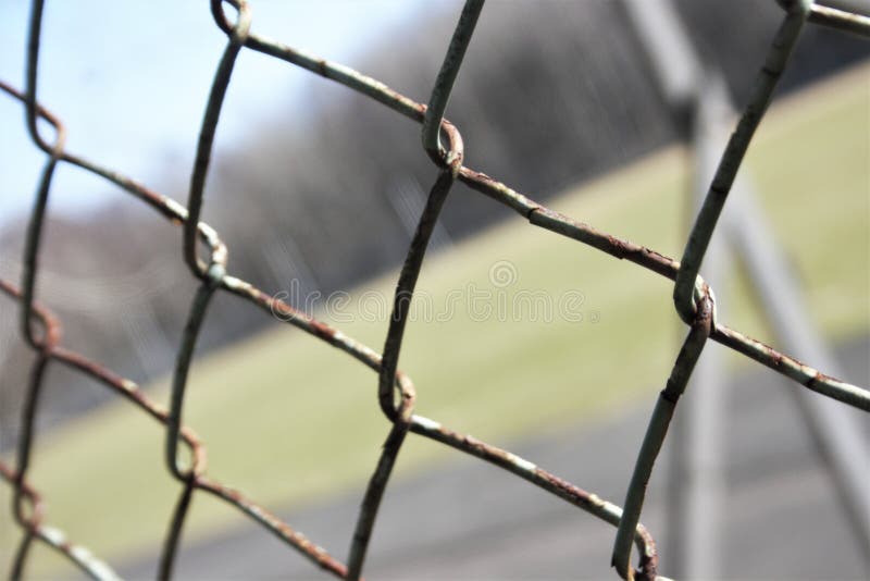 Outside the Fence Looking in Stock Photo - Image of sportsfield, fence ...