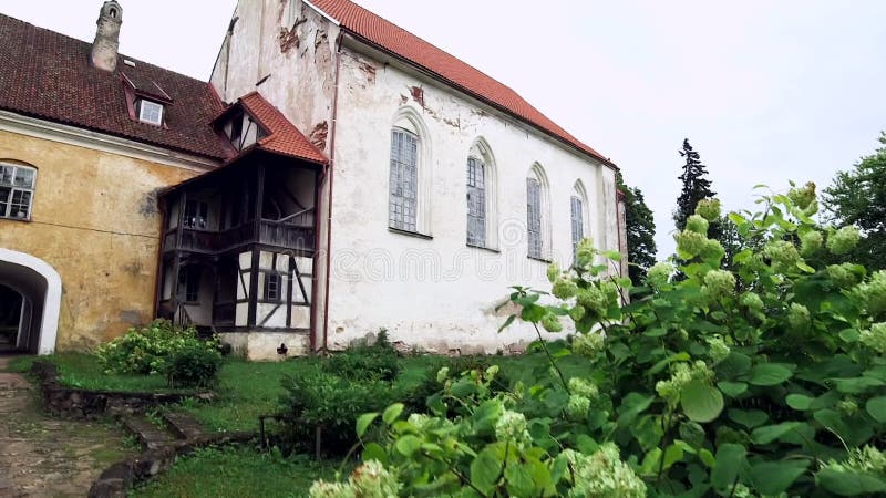 Behind the Hydrangea Bush is Part of Ancient Medieval Castle. Stock ...