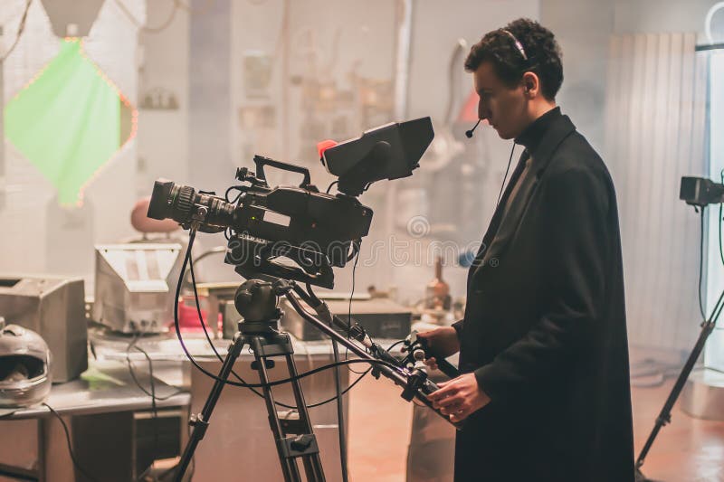 Behind the Scene. Cameraman Shooting Film Scene with His Camera Stock ...