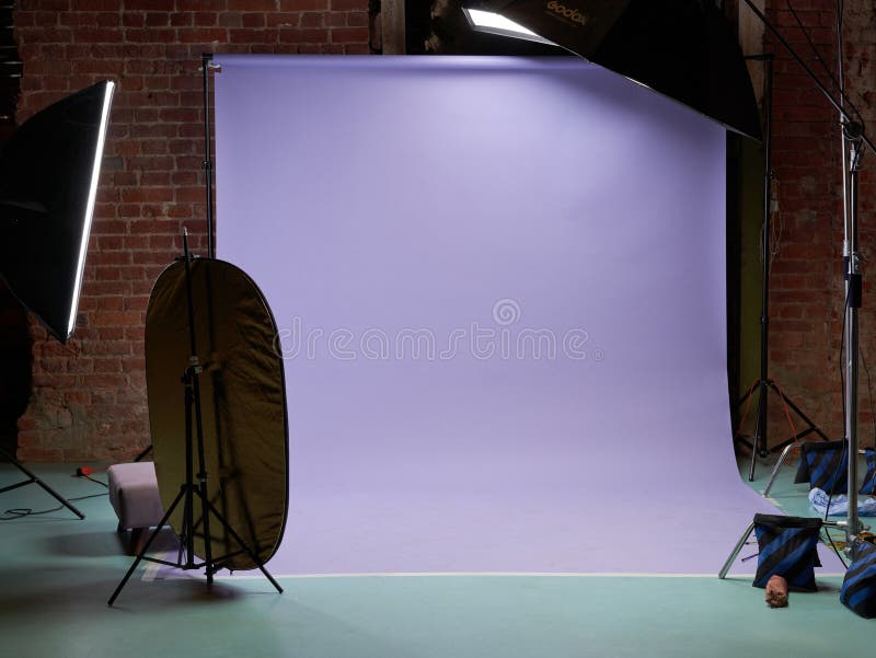 Behind-the-scenes at a Photo Shoot, the Studio Setup Includes Lighting ...