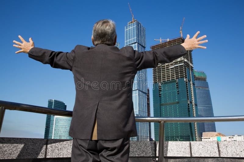 Behind Senior Man at the Building with Hand Up Stock Photo - Image of ...