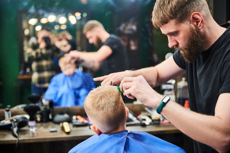 Behind Shoulder View of Male Barber Cutting Little Boy& X27;s Hair ... Behind Shoulder View of Male Barber Cutting Little Boy& X27;s Hair ...