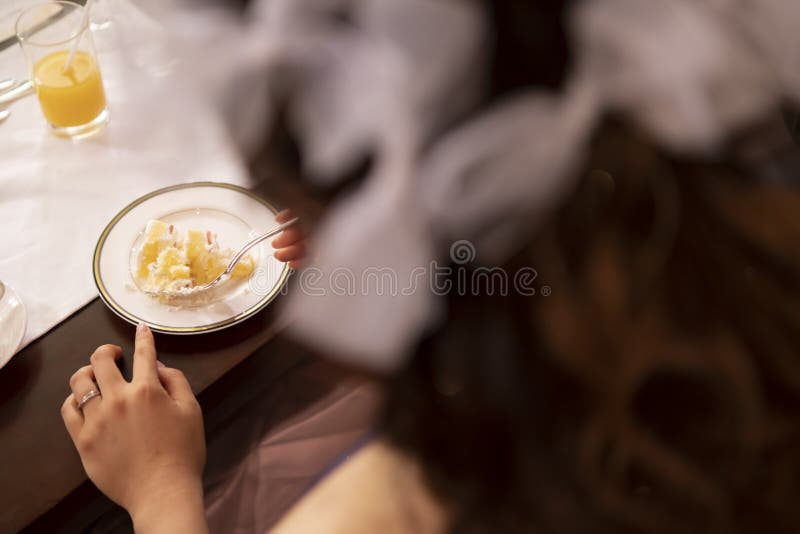 From Behind Where the Bride is Eating Cake at the Wedding Stock Image ...