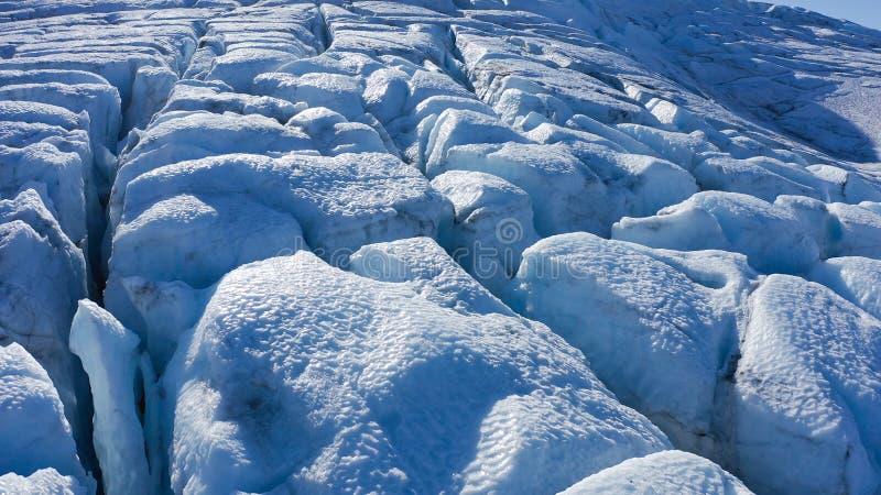 Behold the Majestic Glacier Patterns Set Against a Clear Blue Sky with ...