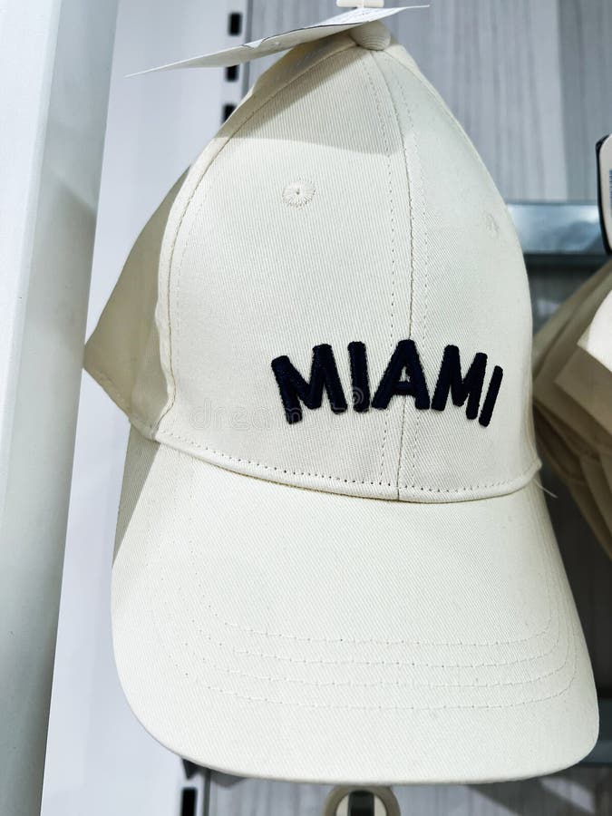 Beige Baseball Cap with Embroidered Miami Text on a Store Display Rack ...
