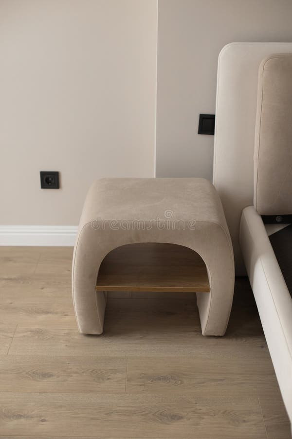 Beige Bedside Table in a Modern Interior Stock Photo - Image of ...
