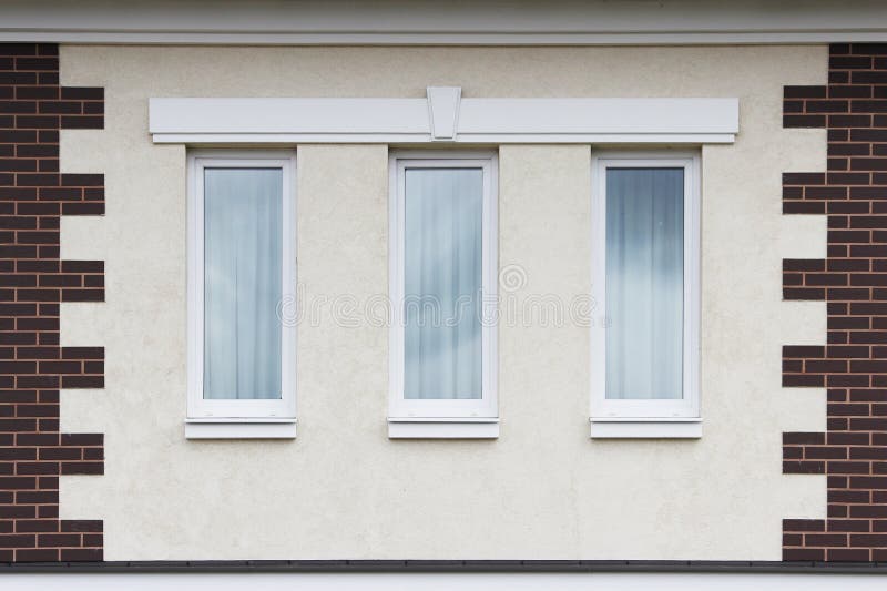 Beige and Brown Brick Wall Three Windows in a Background Image. Stock ...