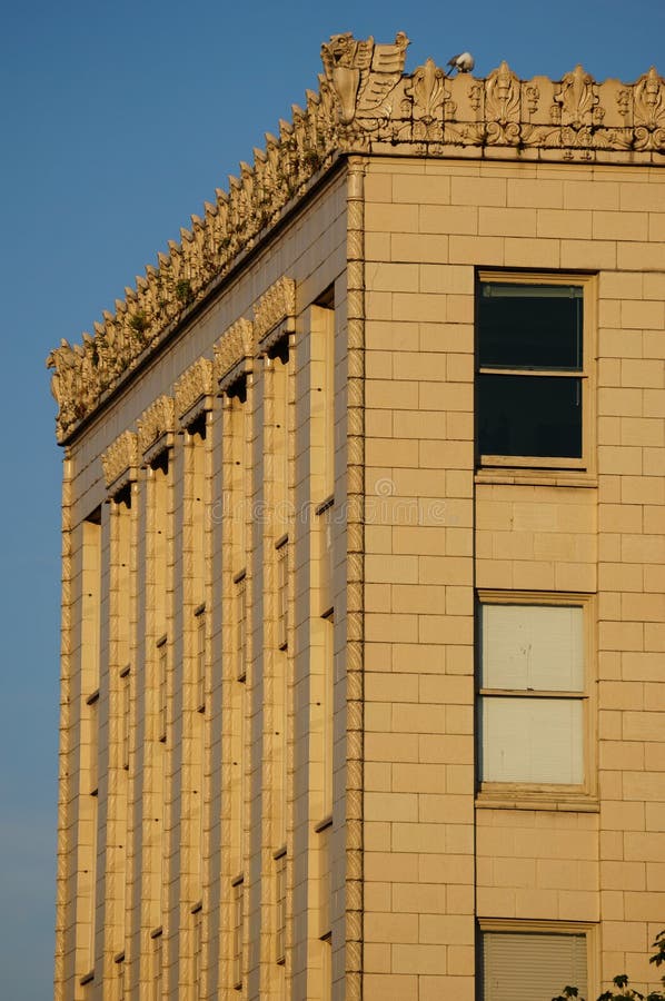 Beige Building with Many Black Windows Stock Photo - Image of blue ...