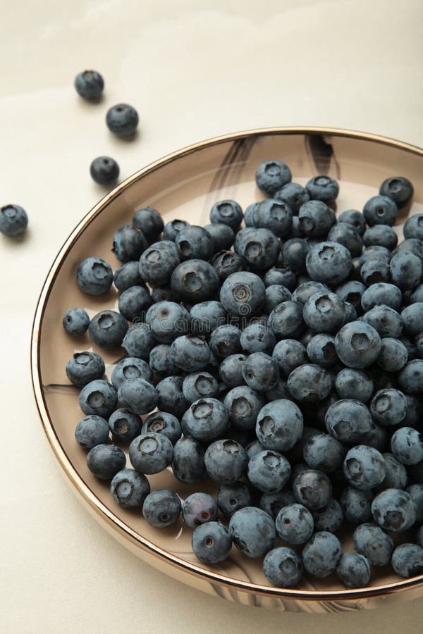Beige Ceramic Bowl of Fresh Ripe Blueberries on Light Background Stock ...