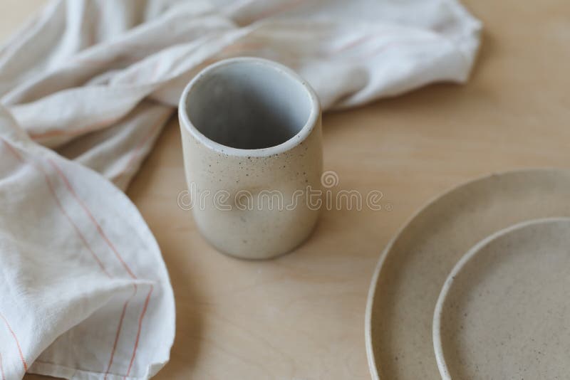 Ceramic Cup and Plates on a Wooden Table Top View. Minimalist Set of ...