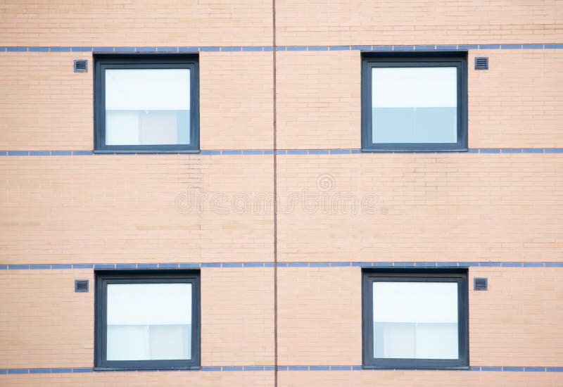 Beige Facade of a Building with Four Windows Stock Photo - Image of ...