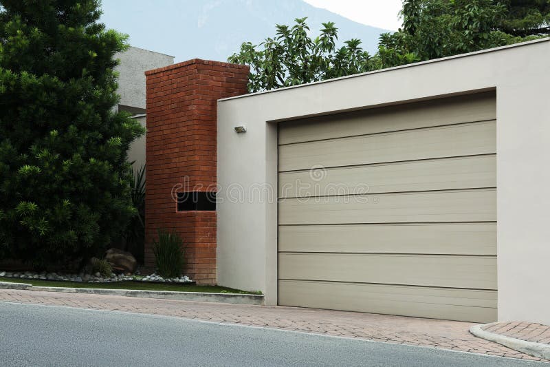 Beige Garage with Closed Sectional Door. Exterior Design Stock Image ...