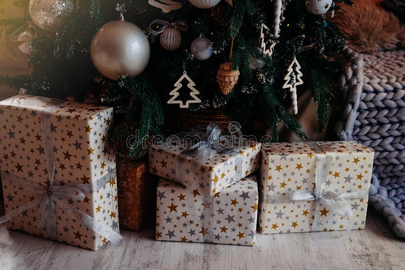 Beige Gift Boxes with Stars Under the Christmas Tree Stock Photo ...