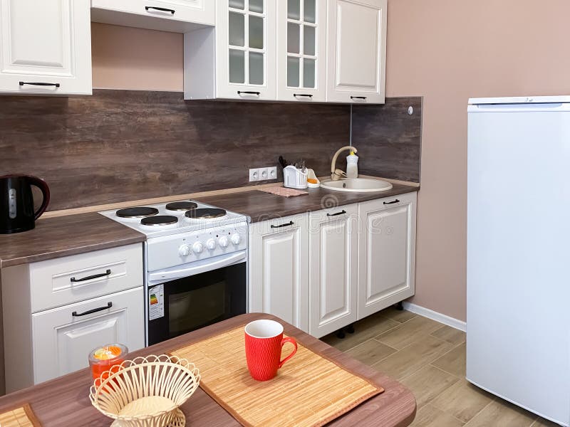 Beige Kitchen Interior with White Kitchen Set and Household Appliances ...