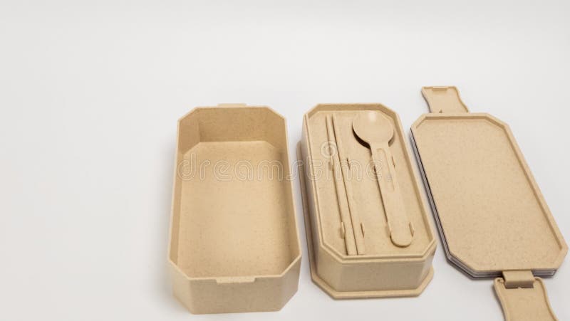 Beige Lunch Box with Chopsticks and Spoon on a White Background Stock ...