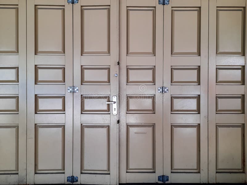 Beige Metal Double Doors with Panels and Hinges Stock Image - Image of ...