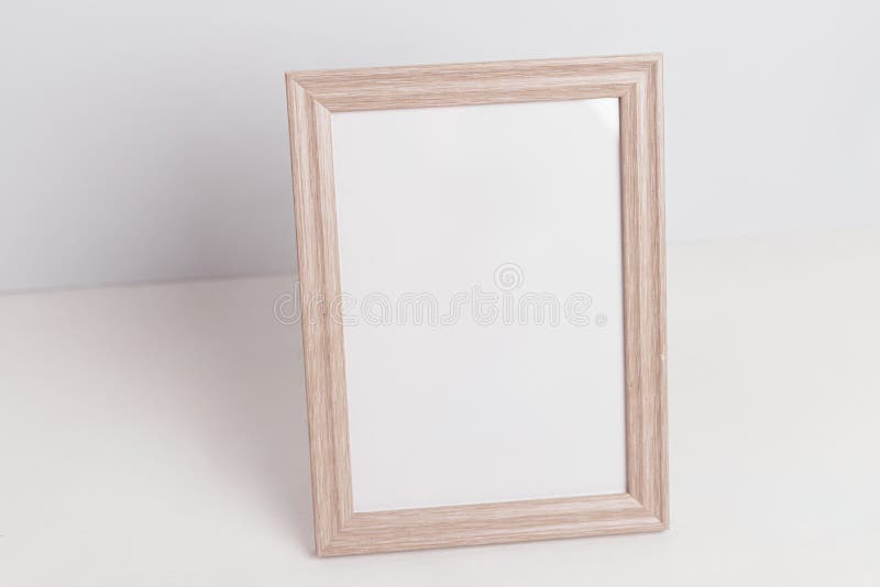 Beige Photo Frame Stands on a White Background Stock Photo - Image of ...