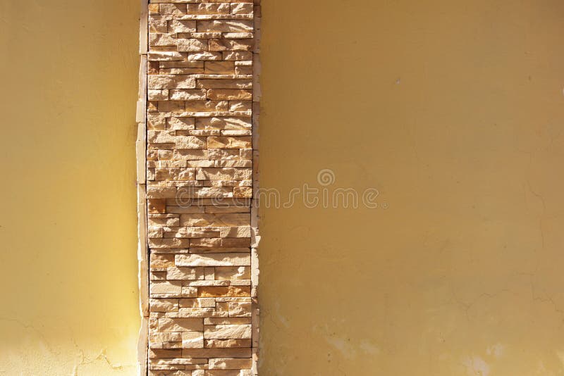 Beige Plastered Wall with an Insert of Natural Limestone of the Same ...