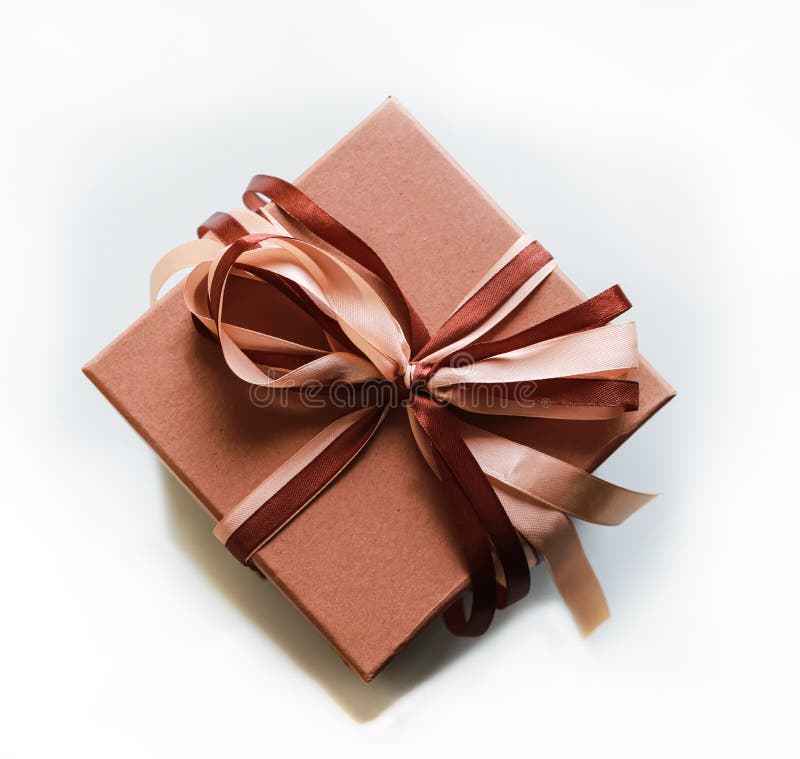 Beige Present Box with Beige and Brown Ribbon Against White Background ...