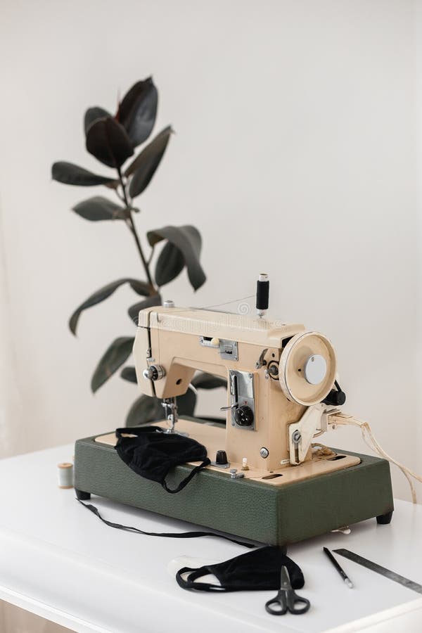 Beige Sewing Machine the Process of Sewing a Protective Medical Mask at ...