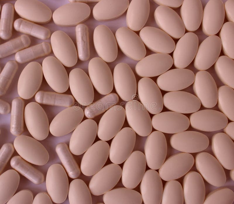 Beige Tablets of an Oblong Shape with a Solid Background. Stock Image ...